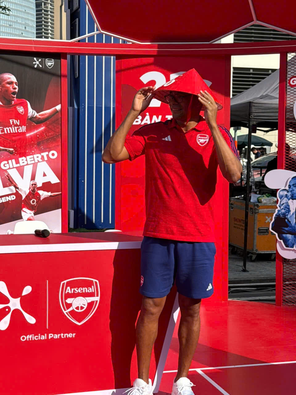 Arsenal legend Gilberto Silva wears a conical hat and juggles the ball ...